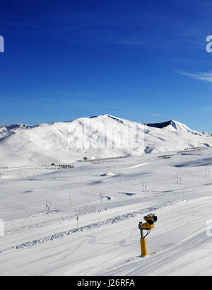Ski slope with snowmaking at sun day. Greater Caucasus, Shahdagh ...