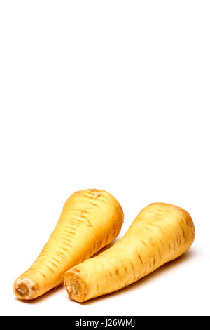 Two organic parsnips on a white studio background Stock Photo - Alamy