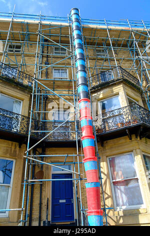Builders scaffolding waste chute Stock Photo - Alamy