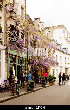 The streetlife in Paris, France with people walking on the street near ...
