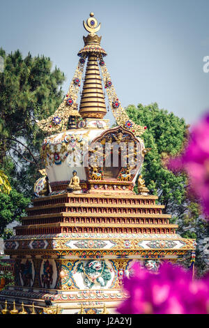 Buddhist stupa in beautiful colours situated inside gounds of the ...
