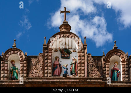 A cross outside a church in peru, showing symbols of crucifixion ...