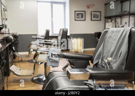 Empty chairs at barber shop Stock Photo - Alamy