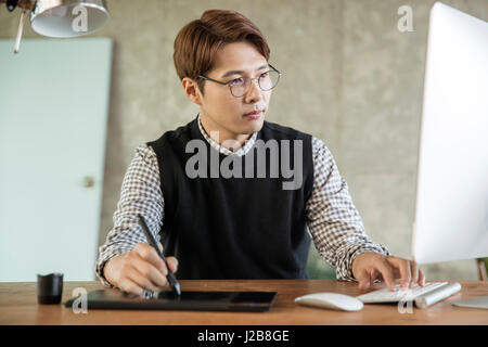 Portrait of cartoonist working Stock Photo - Alamy