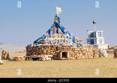 Mongolian sacred cairn or ovoo & prayer flags to worship mountains, sky ...