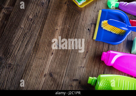 Spring cleanup theme. Variety of colorful house cleaning products on a ...