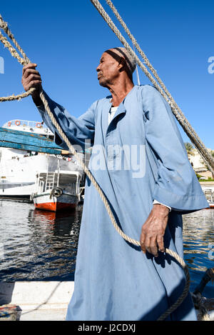 Egypt, Aswan Governorate, Aswan, Boat moored on bank of Nile Stock ...