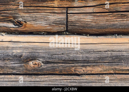 wall made of wooden logs. Brown Wooden Debarked Logs Stock Photo - Alamy