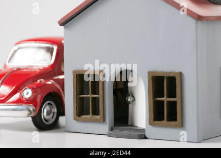 Izmir, Turkey - April 1, 2017: Red toy car and miniature house on a ...