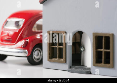 Izmir, Turkey - April 1, 2017: Red toy car and miniature house on a ...