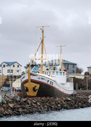 Town of Hofn during winter. Old ship used as a museum in the harbor ...