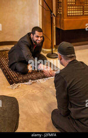 Muslim, handshake and people in mosque for greeting, conversation and ...