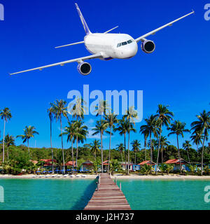 Plane fly over ocean Stock Photo - Alamy