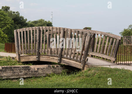Little Pedestrian Curved Wooden Bridge in a Park Stock Photo - Alamy