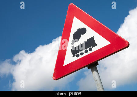 Road sign, level crossing without gate or barrier ahead, give priority ...