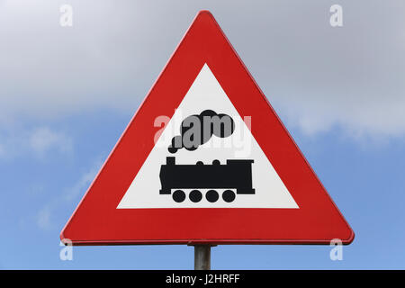 Road sign, level crossing without gate or barrier ahead, give priority ...