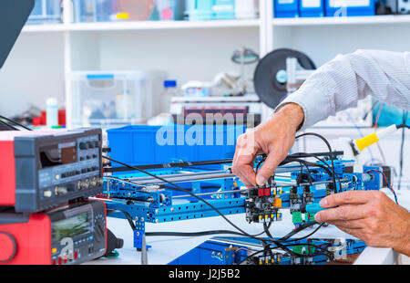 Person working in electronics laboratory Stock Photo - Alamy