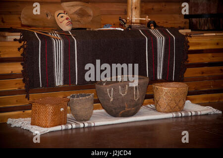 Assortment of traditional Coast Salish carved cedar wood ceremonial ...