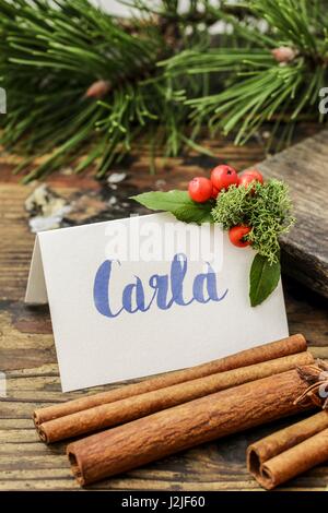 Table place name card with handwritten name Carla. Party decor Stock ...