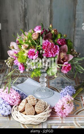 Easter gingerbread cookies and floral arrangement with orchids ...