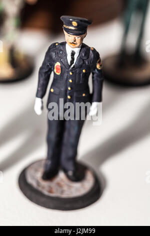 Tiny miniature vintage policeman figurine standing Stock Photo - Alamy