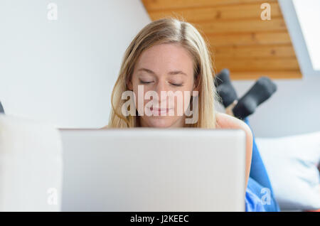 young pretty woman student using portable laptop computer Stock Photo ...