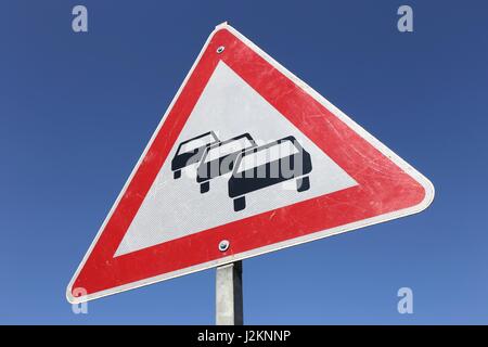 Caution queues likely road sign Stock Photo - Alamy