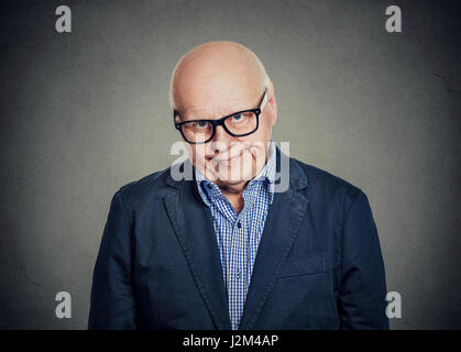 Portrait of unhappy grumpy pissed off senior mature man on blue ...