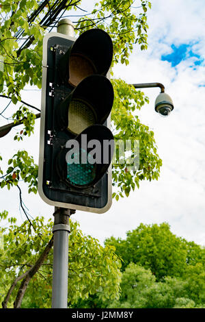 Traffic stop sign at an intersection with speed bump Stock Photo - Alamy