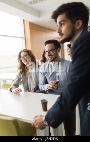 Two business partners having a conversation while sitting at the cafe ...