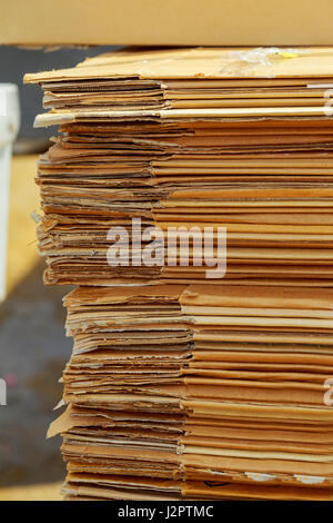 Stacking used cardboard box for recycling Stock Photo - Alamy