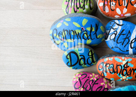 Close up of painted pebbles Painted stones Names Decoration Decorated ...