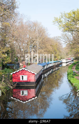 Basingstoke Canal Visitor Centre with tourist trip boat moored in ...