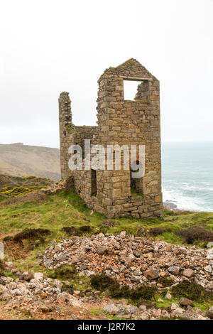 The preserved ruins of Wheal Edward engine winding house on the cliff ...