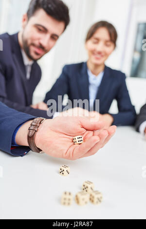 Business people play dice game for creative team building workshop ...