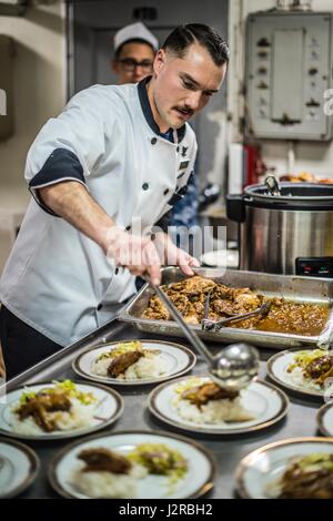 USS Theodore Roosevelt culinary specialists prepare meals in the ...