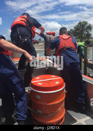 A Coast Guard 27-foot Special Purpose Craft-Shallow Water boat crew and ...