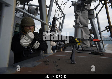 Sailors aboard USS Carney, an Arleigh Burke-class guided-missile ...