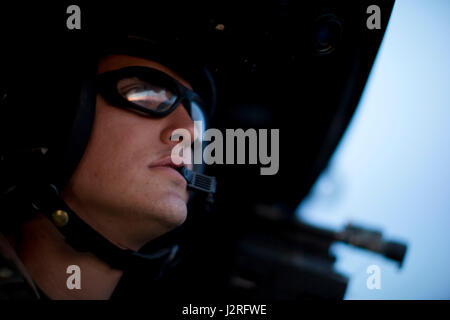 A Marine crew chief from HMLA-269 inspects a UH-1 Huey at Marine Corps ...