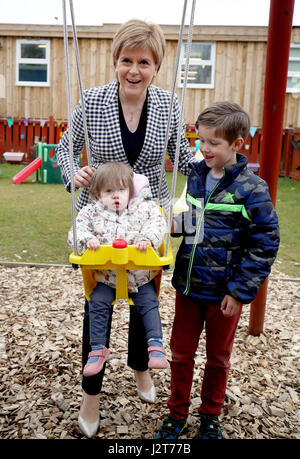 SNP leader Nicola Sturgeon with Scott Ruddick, 7, (left) and his baby ...