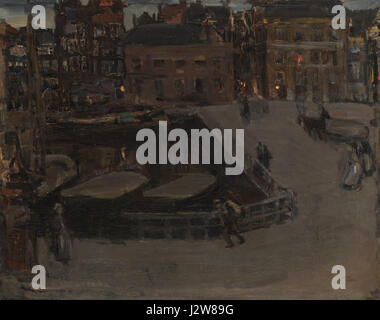 Evening view of a city street with a prominent tower in the background ...