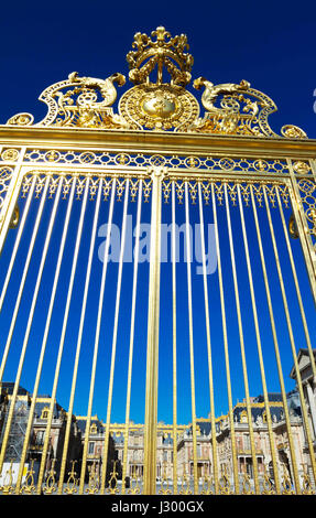 Gate ornate with golden design at Versailles Palace, France Stock Photo ...