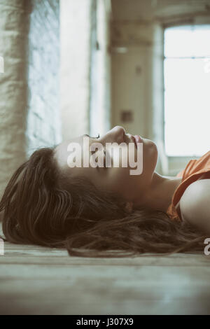 Dead woman on the floor Stock Photo - Alamy