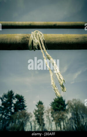 Old rope hanging from a wooden fence Stock Photo - Alamy
