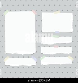 White ripped notebook, copybook sheets stuck with sticky tape on grey ...