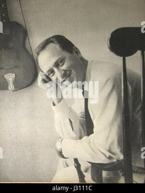 Italian singer and songwriter Nico Fidenco (Domenico Colarossi) sitting ...