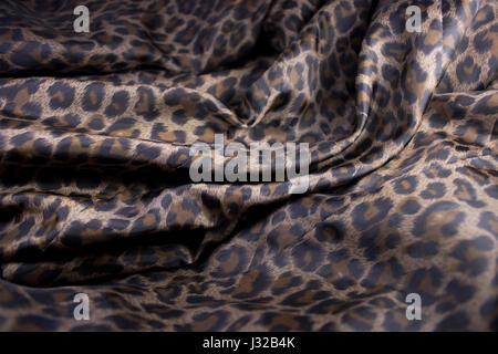 shiny leopard fabric cloth garment textile industry Stock Photo - Alamy
