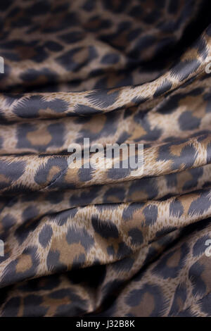 shiny leopard fabric cloth garment textile industry Stock Photo - Alamy