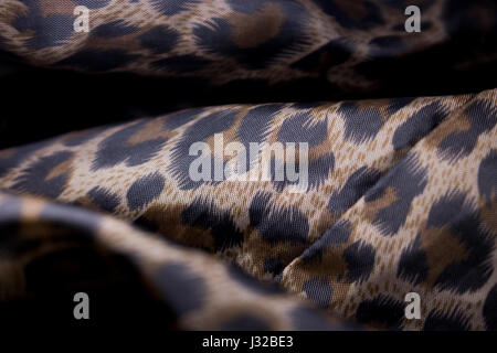 shiny leopard fabric cloth garment textile industry Stock Photo - Alamy