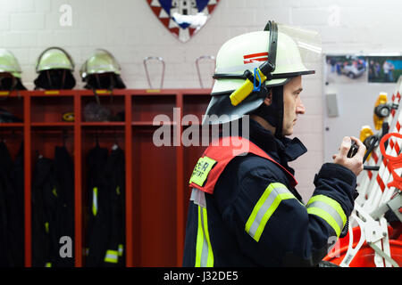 German firefighter leader used a walkie talkie in action Stock Photo ...